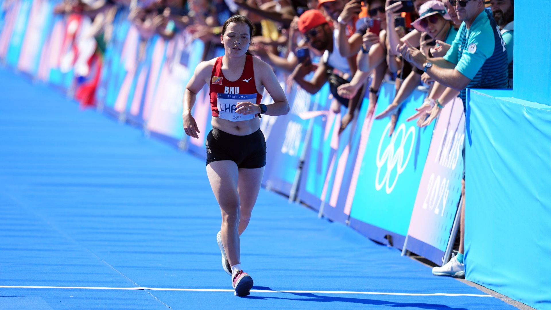 Bhutan’s Kinzang Lhamo fulfills promise, finishes marathon | NBC Olympics