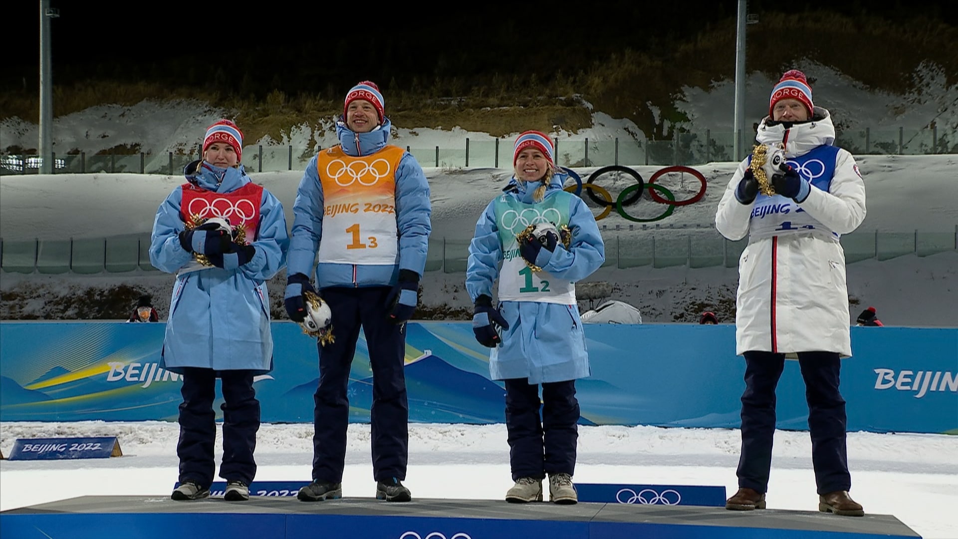 Biathletes step on the podium after mixed 4x6km relay | NBC Olympics