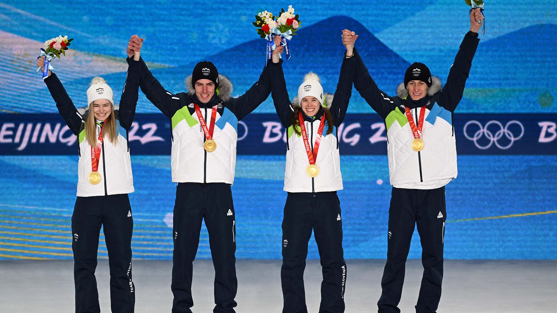 Slovenia receives gold in debut of mixed team ski jumping | NBC Olympics